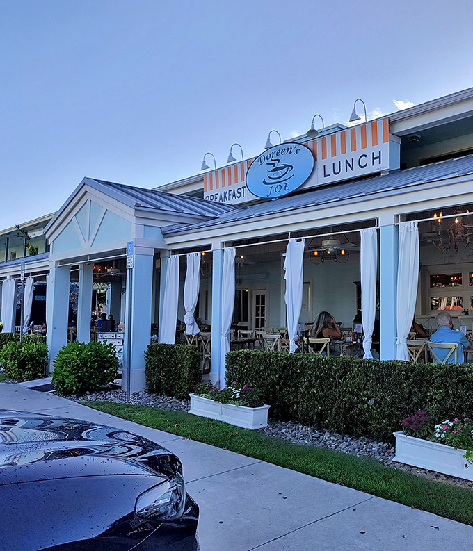 The blue and white fa&ccedil;ade with those cheerful orange-striped awnings practically whispers, "Your morning is about to get significantly better." Welcome to breakfast paradise.