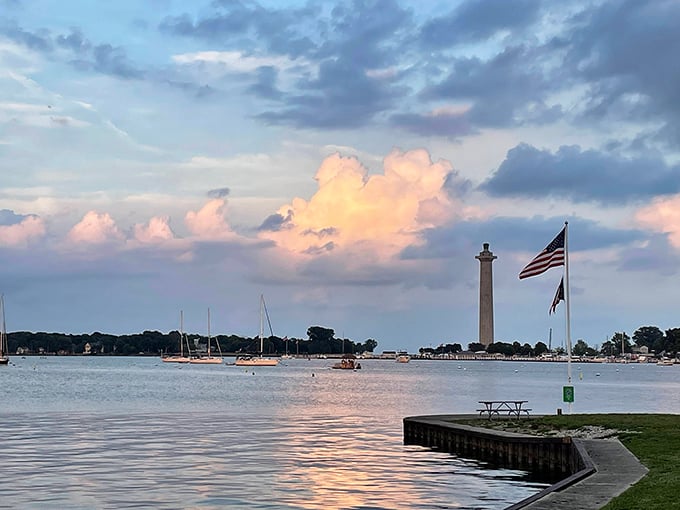 Sunset magic at Oak Point State Park, where Lake Erie's waters meet a sky painted in pastels and Perry's Monument stands sentinel over island memories.