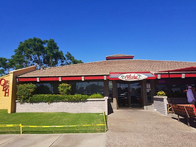 The sunshine-yellow exterior with its cheerful red trim promises what every breakfast lover seeks: a place where calories don't count before noon.