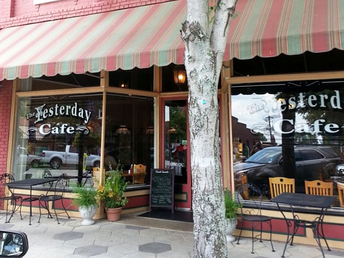 The classic red brick and striped awning exterior isn't just charming&mdash;it's the gateway to buttermilk pie paradise. Small-town America at its most delicious.