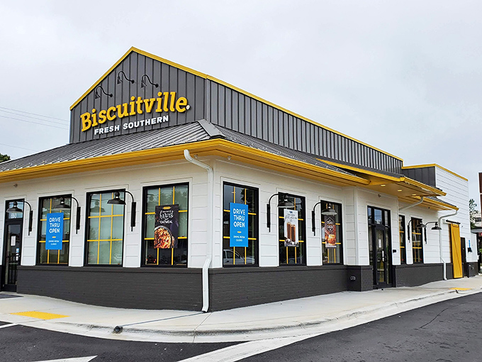 The bright yellow Biscuitville sign stands out like a breakfast beacon, promising Southern comfort in biscuit form to hungry North Carolinians.