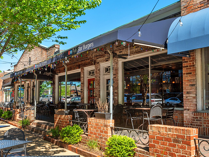 The charming brick exterior of 5 Star Burgers beckons like an old friend with a delicious secret. String lights add that perfect touch of "come on in" warmth.