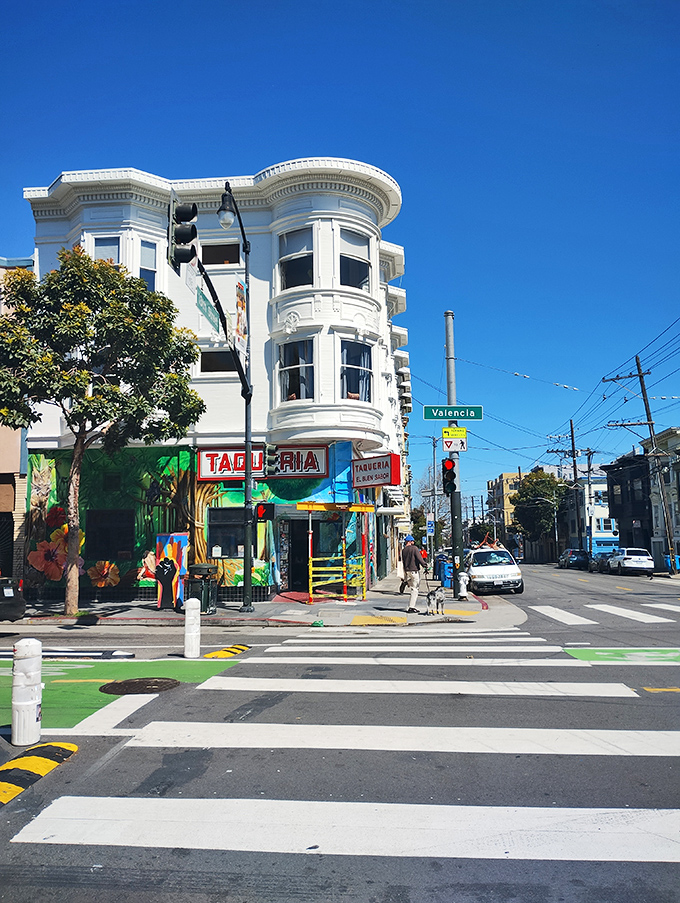 The corner spot that launched a thousand food debates. Taqueria El Buen Sabor's iconic red signage beckons hungry souls into Mission burrito paradise.