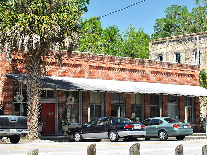 Brick storefronts with palm trees standing guard &ndash; Micanopy's main street feels like stepping into a time capsule where Florida's past lives comfortably in the present.