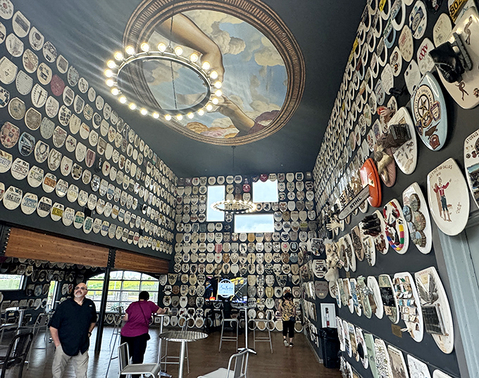 Wall-to-wall toilet seat art transforms this museum into a temple of unexpected creativity. Every inch tells a different story.