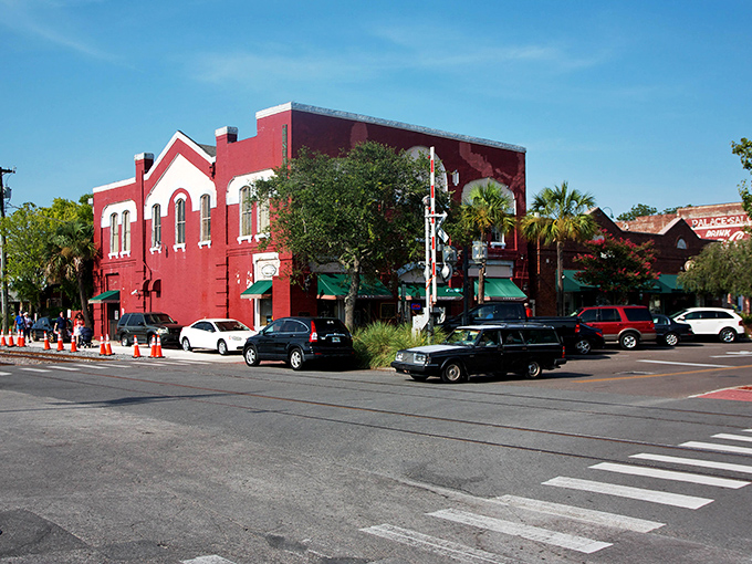 Historic red brick buildings stand proudly on Centre Street, where Victorian charm meets Florida sunshine in downtown Fernandina Beach.