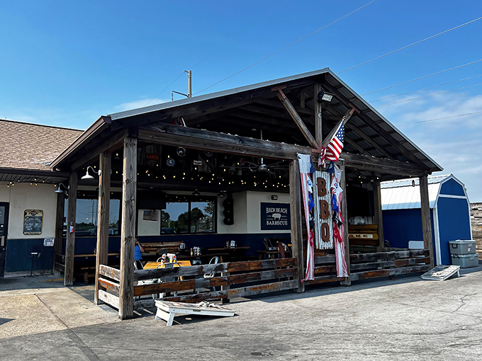 The rustic wooden porch says "serious barbecue joint" before you even smell the smoke. Like finding a treasure map where X marks the brisket.