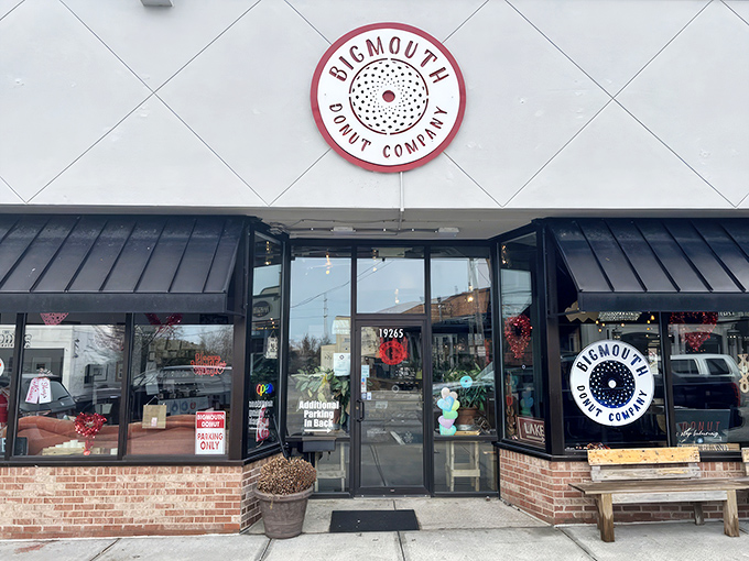 The unassuming storefront of Bigmouth Donut Company beckons with its clean white facade and distinctive circular logo&mdash;proof that donut paradise often hides in plain sight.