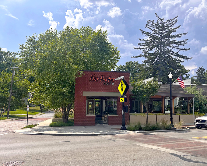 Nestled on a corner in Uptown Westerville, Northstar Caf&eacute;'s brick exterior promises culinary delights within. The American flag adds a touch of hometown charm.