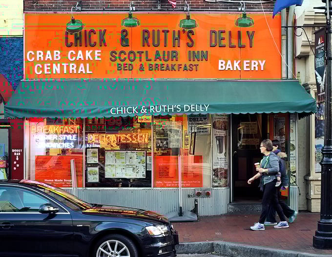 The iconic orange storefront of Chick & Ruth's Delly stands as a beacon of comfort food on Annapolis' Main Street, promising delicious memories in the making.