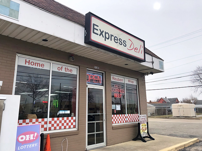 The unassuming storefront with its glowing "HOT CORNED BEEF" sign is like a lighthouse for sandwich lovers lost in a sea of mediocre lunch options.