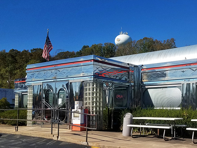 The gleaming stainless steel exterior of Maddy's Diner 23 shines like a beacon of hope for hungry travelers. This classic American diner promises nostalgic comfort in every bite.