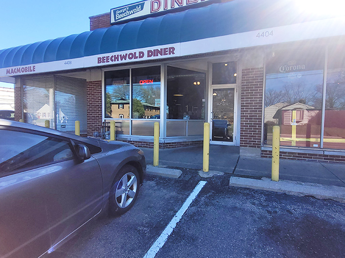 The classic diner facade that promises breakfast magic &ndash; sometimes the best treasures hide behind humble brick walls.