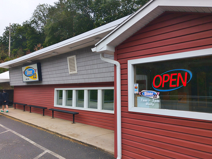Red siding and honest signage announce a place where breakfast dreams come true daily.