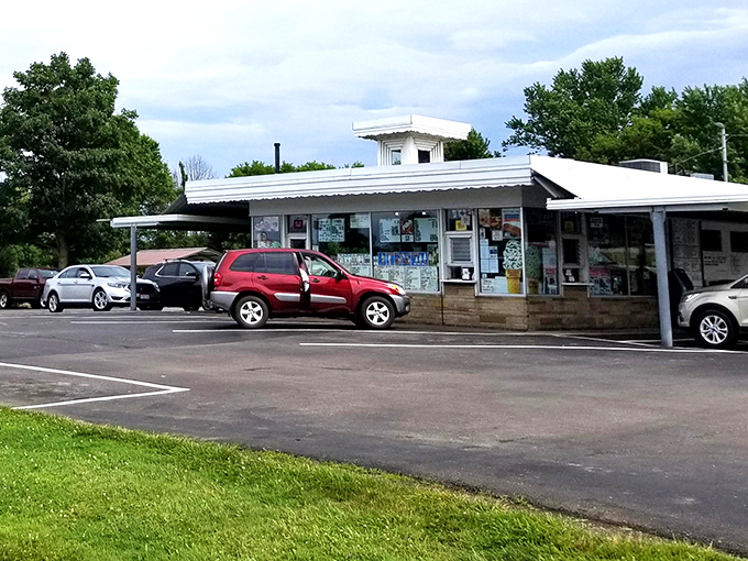 The classic white exterior of Dalton Dari-ette stands like a time capsule from simpler days, when drive-ins were America's culinary town squares.