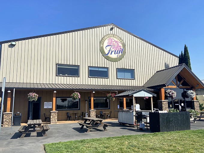 The unassuming exterior of Willamette Valley Pie Company stands like a delicious secret waiting to be discovered, complete with inviting picnic tables for pie enthusiasts.