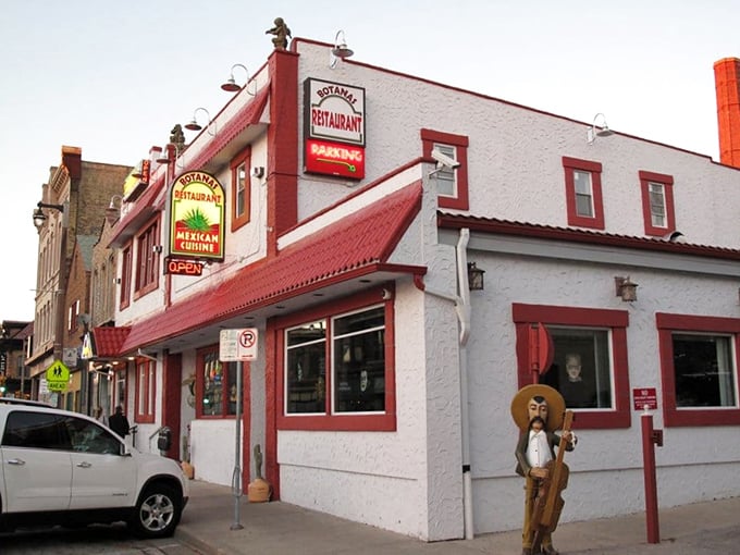 The iconic white building with red trim stands like a beacon of Mexican culinary promise on Milwaukee's South 5th Street. That wooden amigo is just waiting to welcome you inside! 