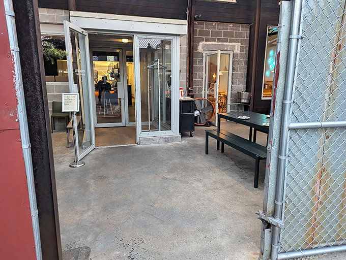 The unassuming entrance to Pizzeria Beddia feels like discovering a secret doorway to pizza paradise. Industrial-chic meets culinary magic.