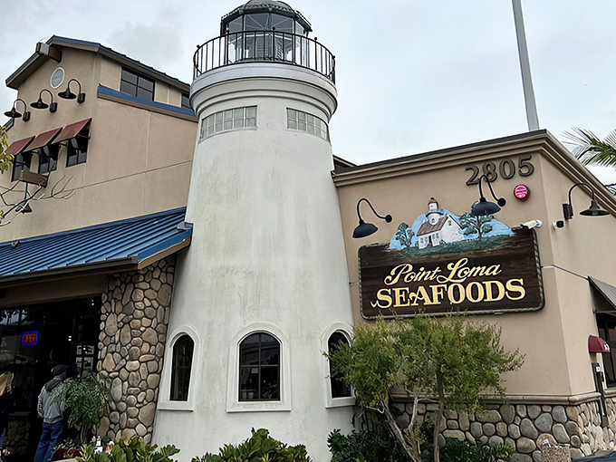 The lighthouse-inspired exterior of Point Loma Seafoods stands like a maritime beacon, guiding hungry souls to seafood nirvana in San Diego's harbor.