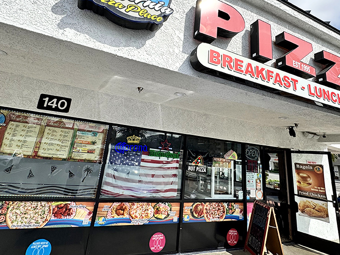 The unassuming storefront that houses culinary treasures. Bold red letters and an American flag promise simple pleasures that exceed all expectations.