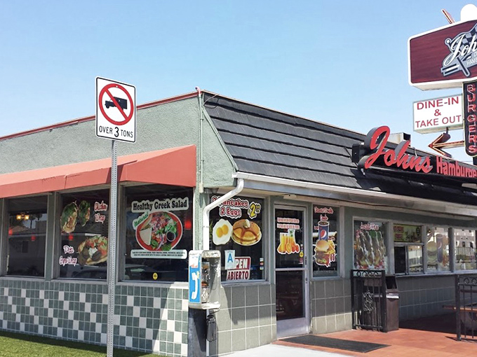 The classic green-tiled exterior of John's Drive-In stands like a time capsule of California burger history, beckoning hungry travelers from miles around.