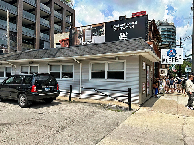 The unassuming white building with the iconic blue sign stands like a culinary lighthouse in Chicago's urban landscape. Sandwich salvation awaits inside.