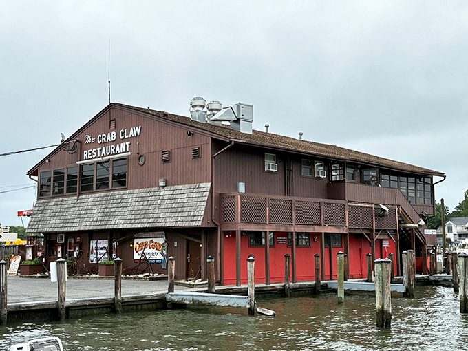 The Crab Claw stands proudly over the water like a rustic sentinel of seafood, its weathered exterior promising authentic Maryland flavors within.