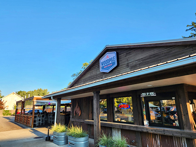 The rustic wooden exterior of Woodpile BBQ Shack promises what every barbecue lover knows: the less fancy it looks, the better the meat tastes.