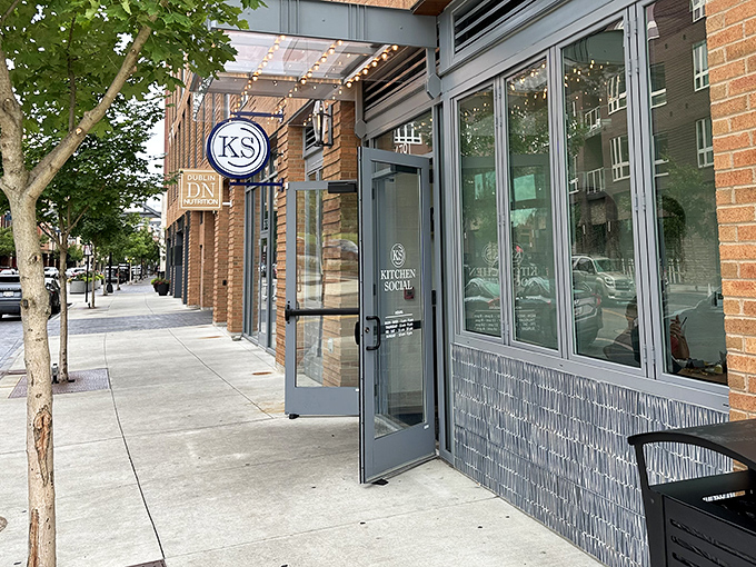 Kitchen Social's sleek blue signage beckons like a culinary lighthouse, promising modern comfort in Dublin's dining landscape.