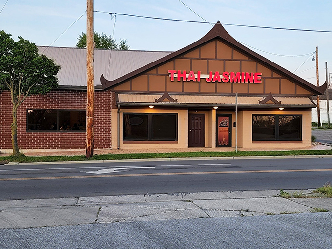 The distinctive peaked roof and bold red signage of Thai Jasmine stands as Lima's portal to authentic Thai flavors, beckoning hungry travelers from miles around.