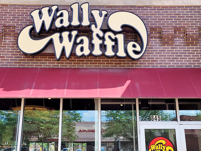The iconic Wally Waffle storefront beckons hungry Ohioans with its cheerful red awnings and promise of breakfast nirvana.