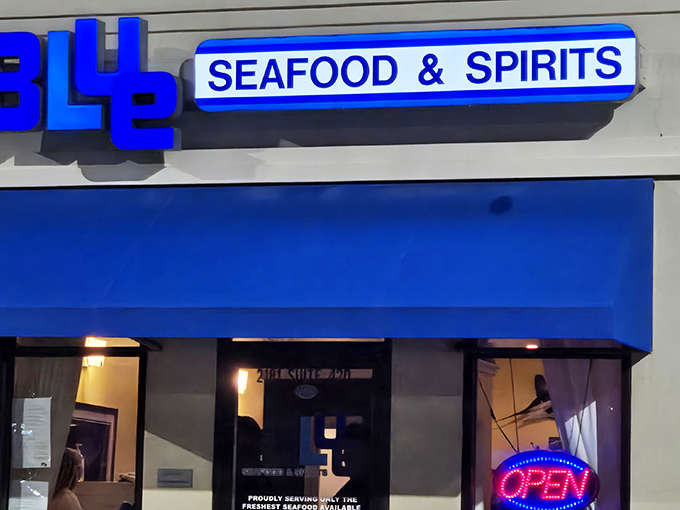 The blue awning beckons like a maritime flag signaling "fresh seafood ahead." This unassuming storefront houses treasures from the deep.