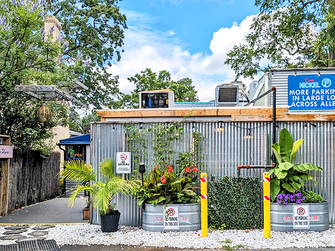Little Nickel's corrugated metal exterior hides a tropical paradise within, like finding a secret tiki bar behind the hardware store.