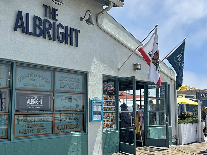 The Albright's charming seaside facade beckons like a siren song. That aqua trim against white walls practically screams "fresh seafood inside!"