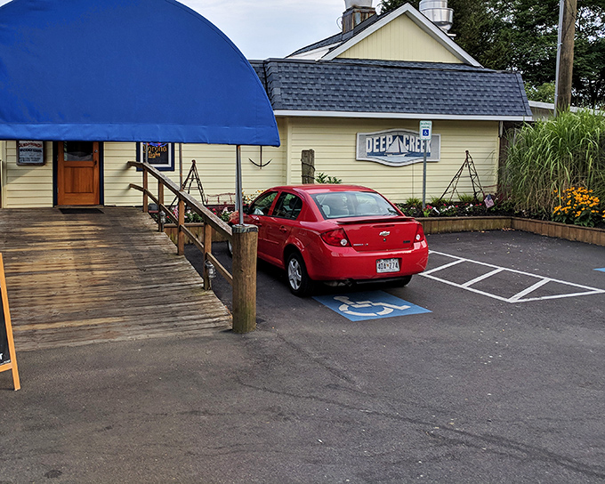 The unassuming yellow exterior with its welcoming blue awning is like that friend who doesn't brag but always delivers an unforgettable meal.
