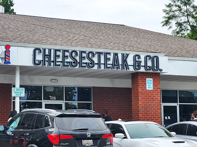 The sign says it all – Cheesesteak & Co. stands proud against the Maryland sky, promising meaty delights within its brick walls.