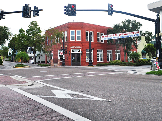 Downtown Dunedin's vibrant intersection showcases the town's colorful character. That bright red building isn't just eye-catching—it's a beacon of the community spirit that makes this place special.
