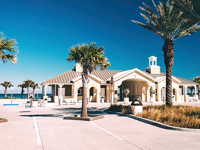 Art Deco dreams come alive on Granada Boulevard, where palm trees stand guard over gleaming white facades that whisper tales of Florida's glamorous past.