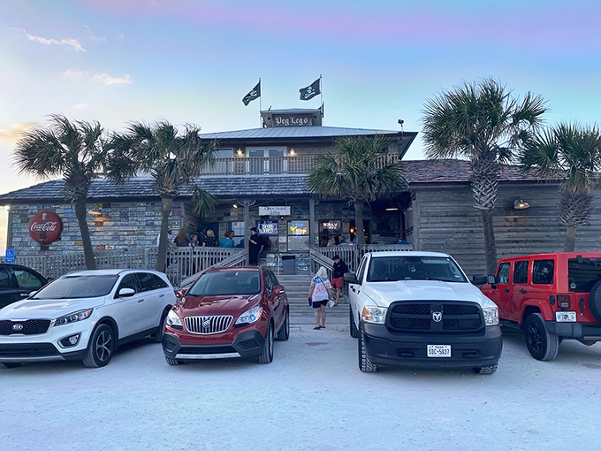 Pirate flags flying high above weathered wood planks&mdash;this isn't just a restaurant entrance, it's the gateway to seafood paradise.