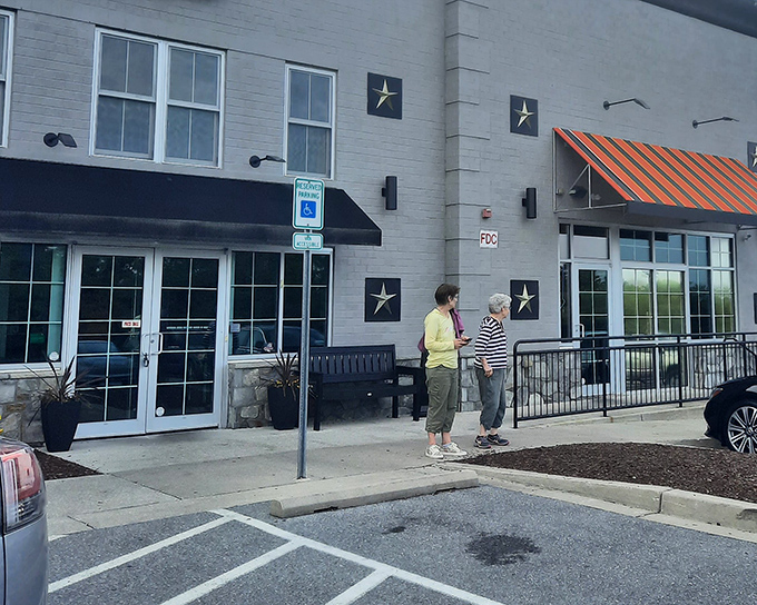 The brick exterior of Glory Days Grill welcomes hungry travelers with its no-nonsense charm and promise of comfort food that delivers.