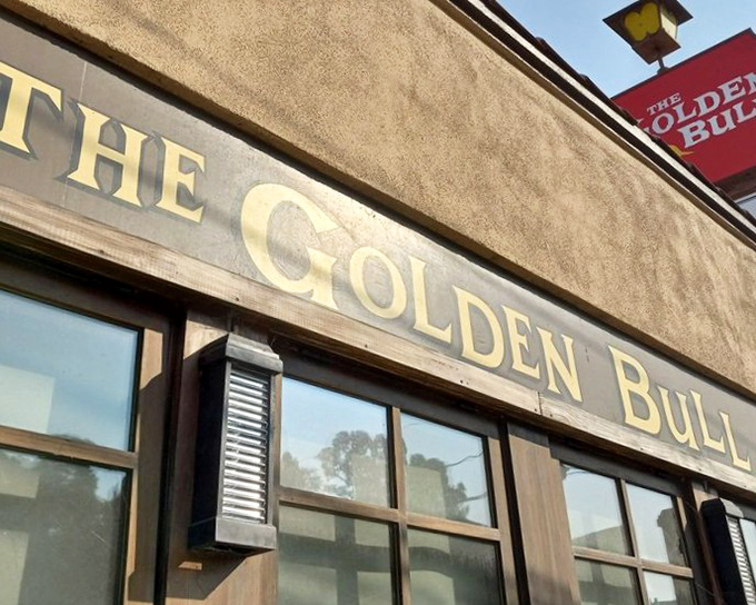 The iconic Golden Bull sign beckons like an old friend, promising carnivorous delights within those unassuming walls. Classic never goes out of style.