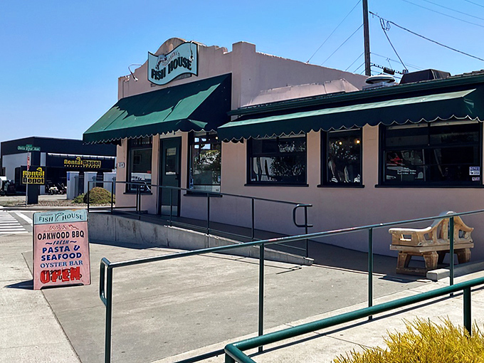 The unassuming pink exterior hides culinary treasures within. Like finding a pearl in an oyster, this modest building houses seafood magic.
