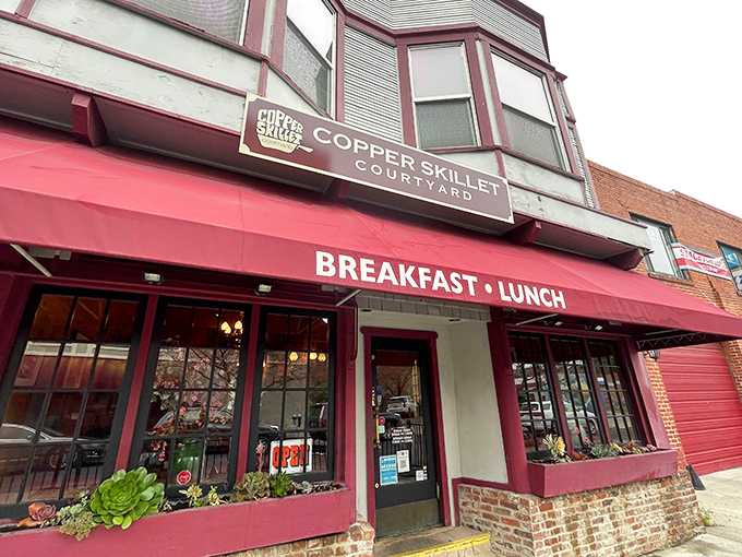 The burgundy awning of Copper Skillet Courtyard beckons like an old friend on Martinez's Main Street, promising comfort food that transcends trendy culinary fads.