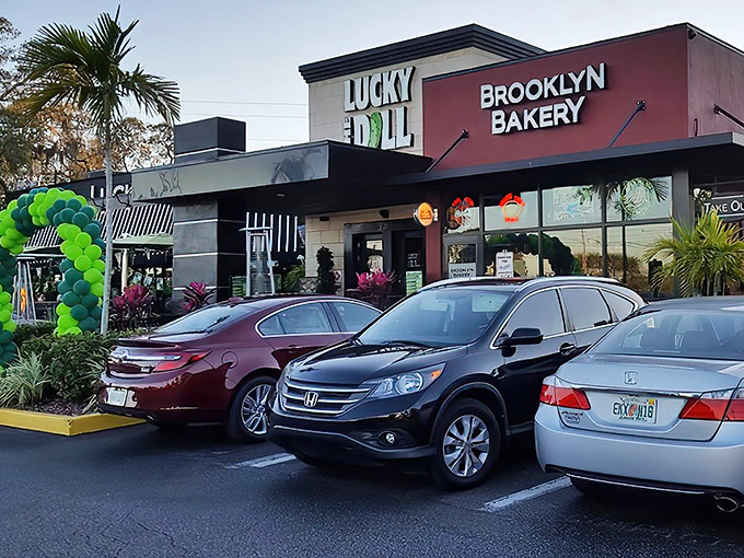 The iconic Lucky Dill sign beckons hungry travelers like a neon-lit lighthouse for sandwich enthusiasts. That green pickle logo? Pure genius.
