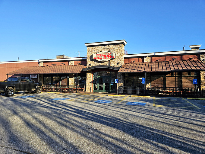Stone facade and brown awnings promise no-nonsense dining. Like a culinary speakeasy, this unassuming exterior hides flavor treasures waiting to be discovered.