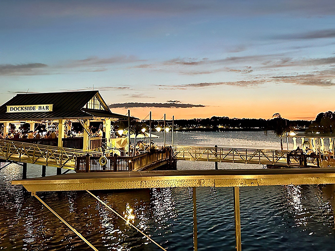 Sunset casts a golden glow over the Dockside Bar, where cocktails and conversation flow as freely as the water beneath.