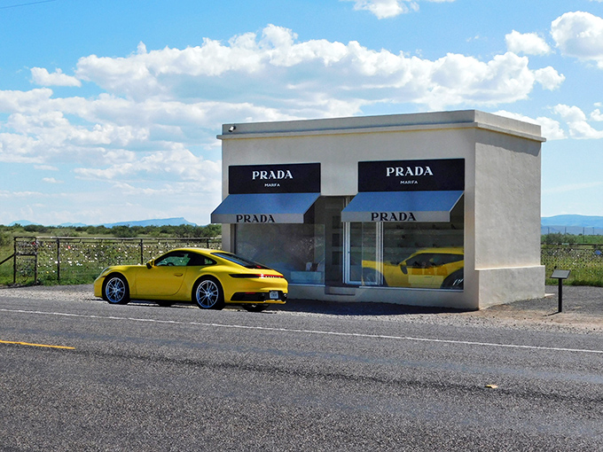 Prada after dark&mdash;where high fashion meets high desert under a canopy of stars. The illuminated storefront creates an otherworldly glow against the inky Texas night.