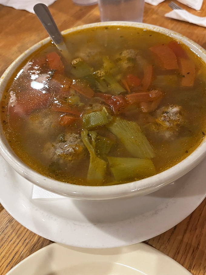 Albondigas soup with meatballs floating like little flavor bombs in aromatic, soul-warming broth.