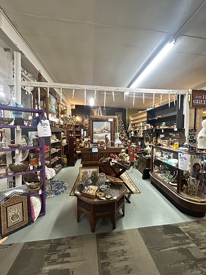 Sale signs mean serious business in this booth packed with curios and collectibles. Half the fun is imagining where each piece began its journey.