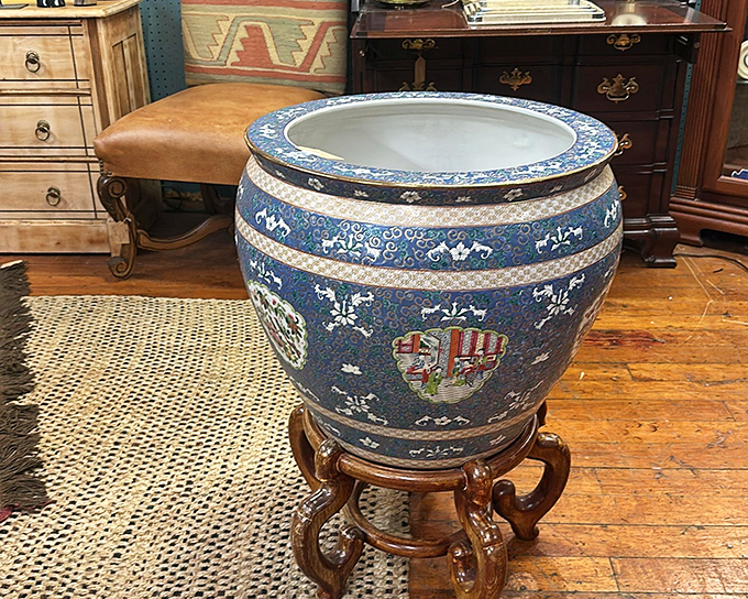 This magnificent Asian-inspired planter isn't just a vessel; it's architectural sculpture that would make even the most neglected houseplant feel important.